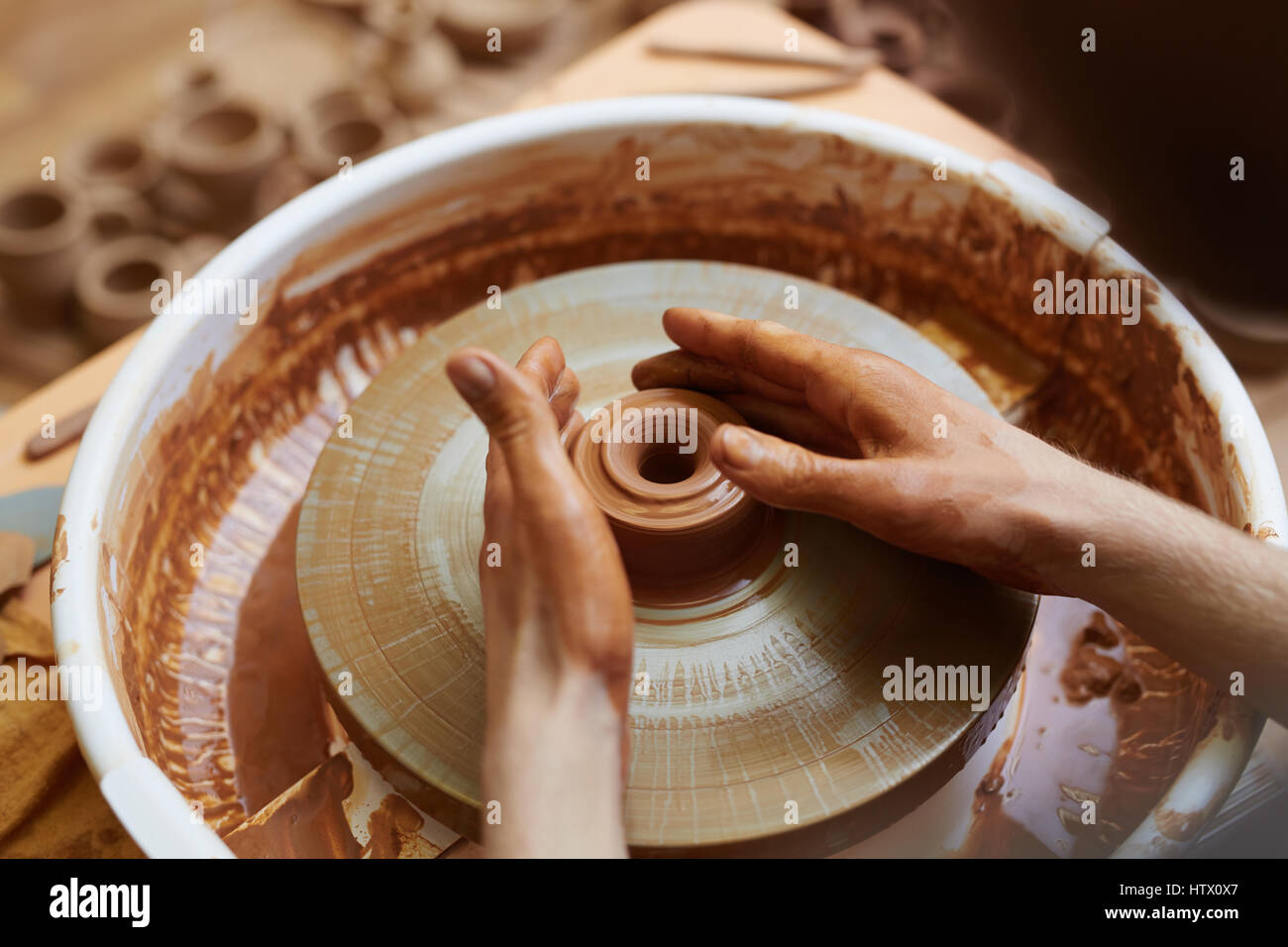 Hands of artisan during pottery work Stock Photo - Alamy