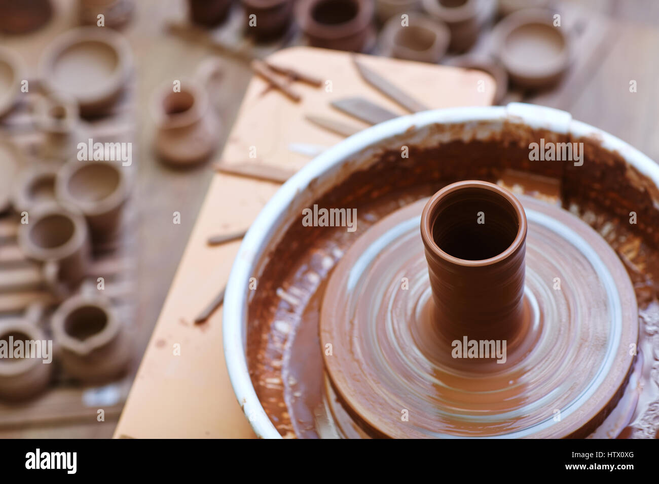 Rotating fireclay machine in workshop of potter Stock Photo - Alamy