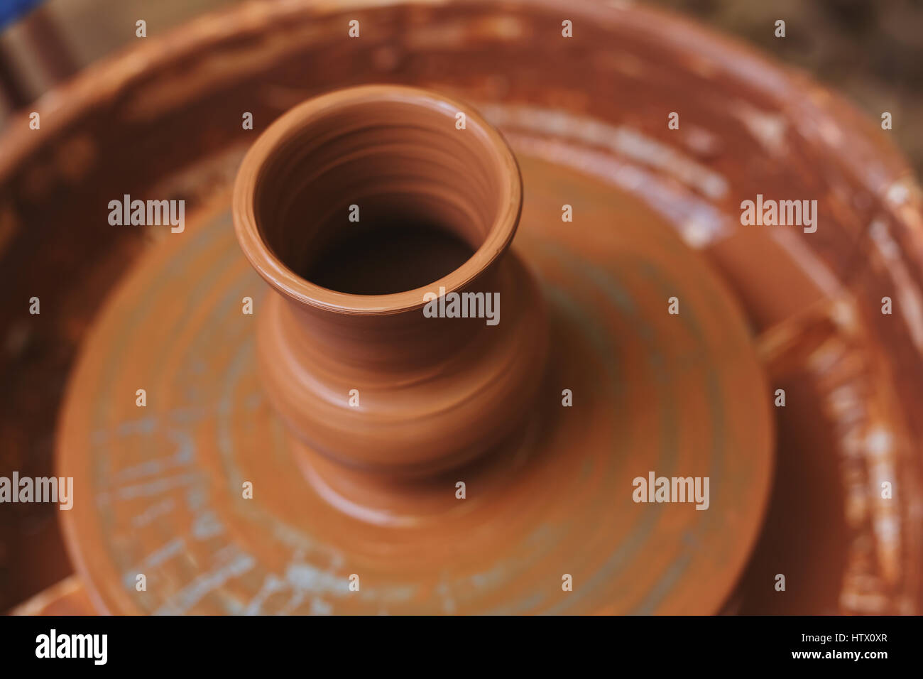 Unfinished fireclay jug in pottery-wheel Stock Photo - Alamy