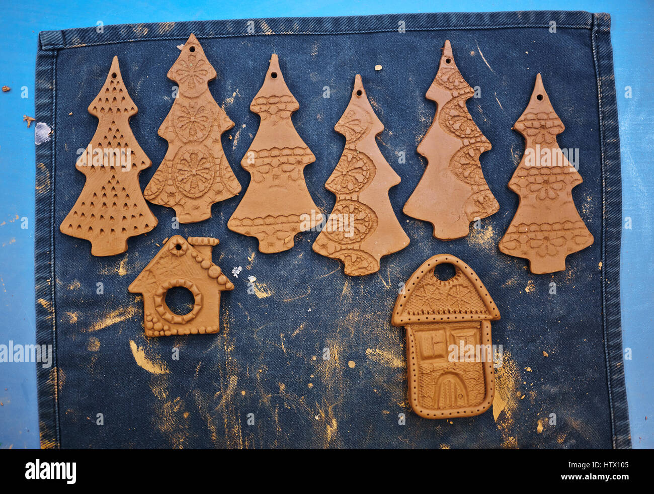 Collection of clay figures on denim textile Stock Photo - Alamy