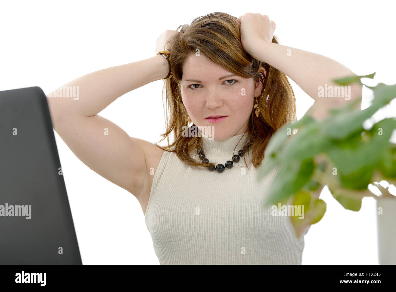 angry young woman working on laptop Stock Photo - Alamy