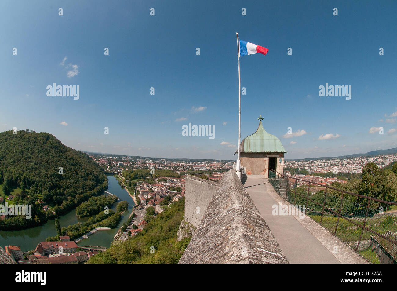 French tricolour flag flying above a tower on the ramparts of the ...