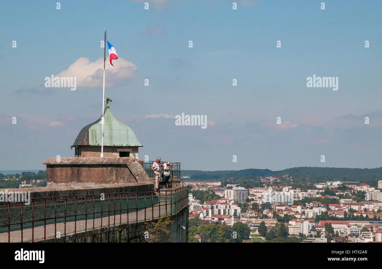 French tricolour flag flying above a tower on the ramparts of the ...