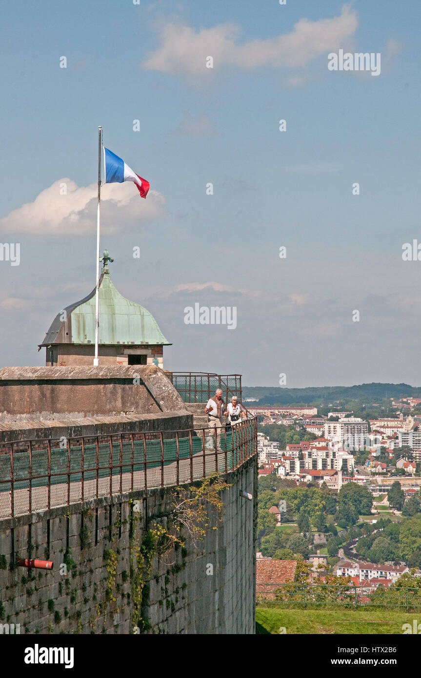 French tricolour flag flying above a tower on the ramparts of the ...