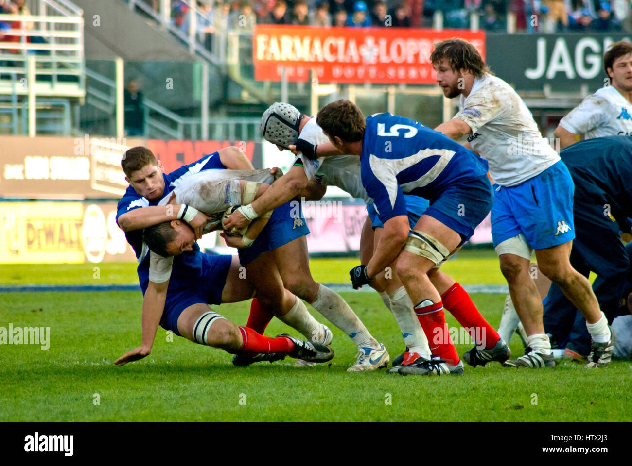 Rugby Six Nations match Italy aganinst France. Players in scrum action ...