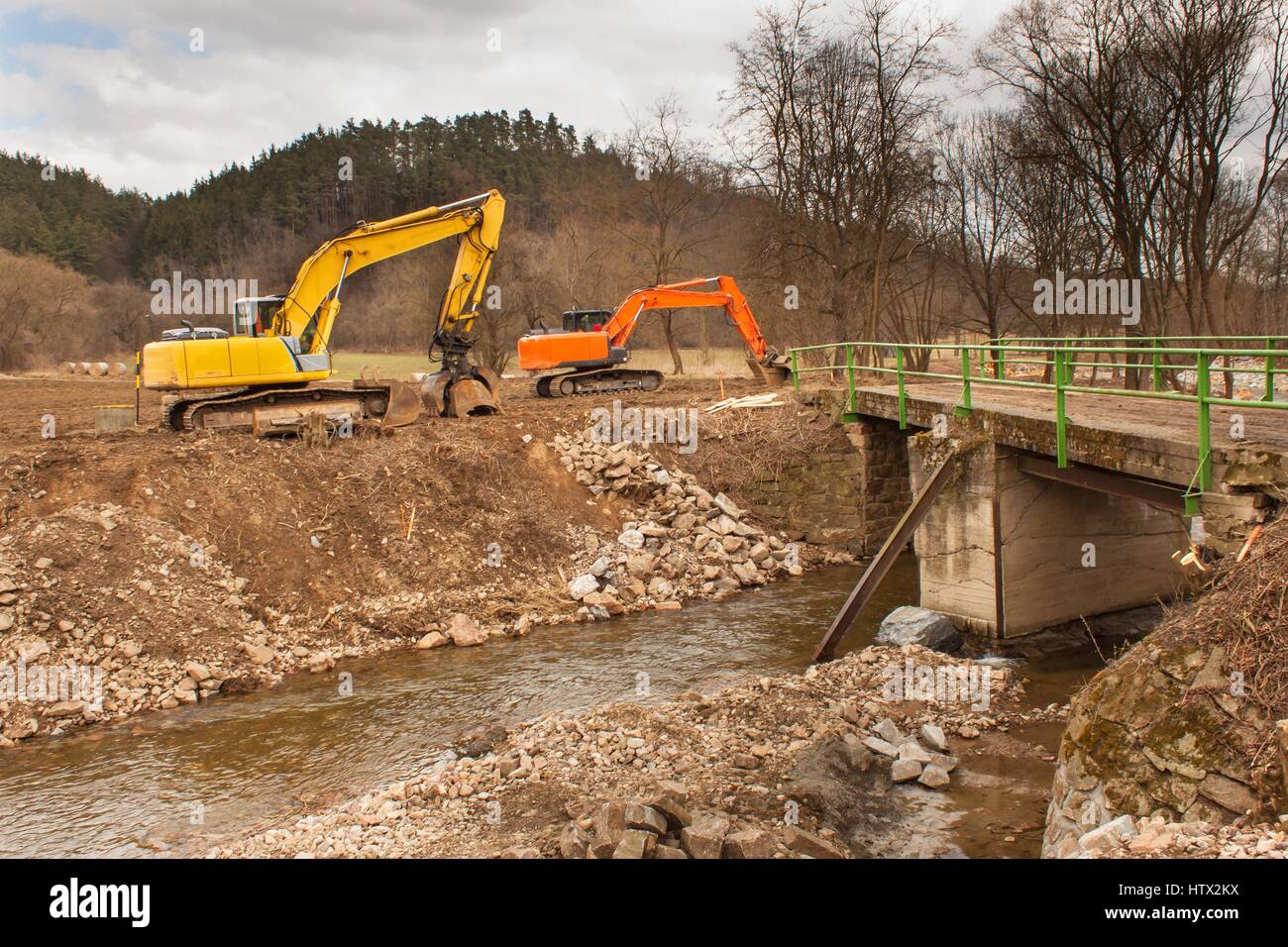 Flood adjustments river. Work on the riverbed. Excavator on the work to ...