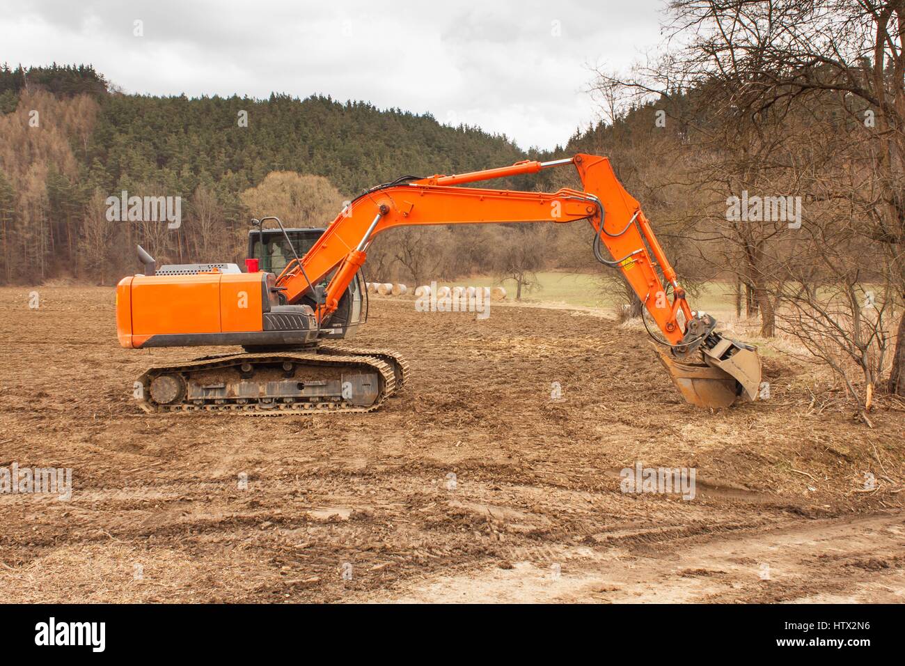 Flood adjustments river. Work on the riverbed. Excavator on the work to ...