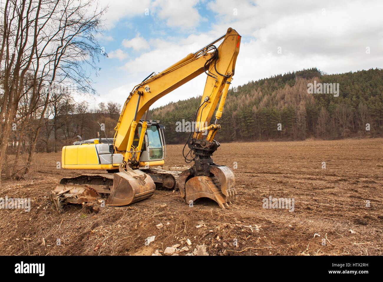 Flood adjustments river. Work on the riverbed. Excavator on the work to ...