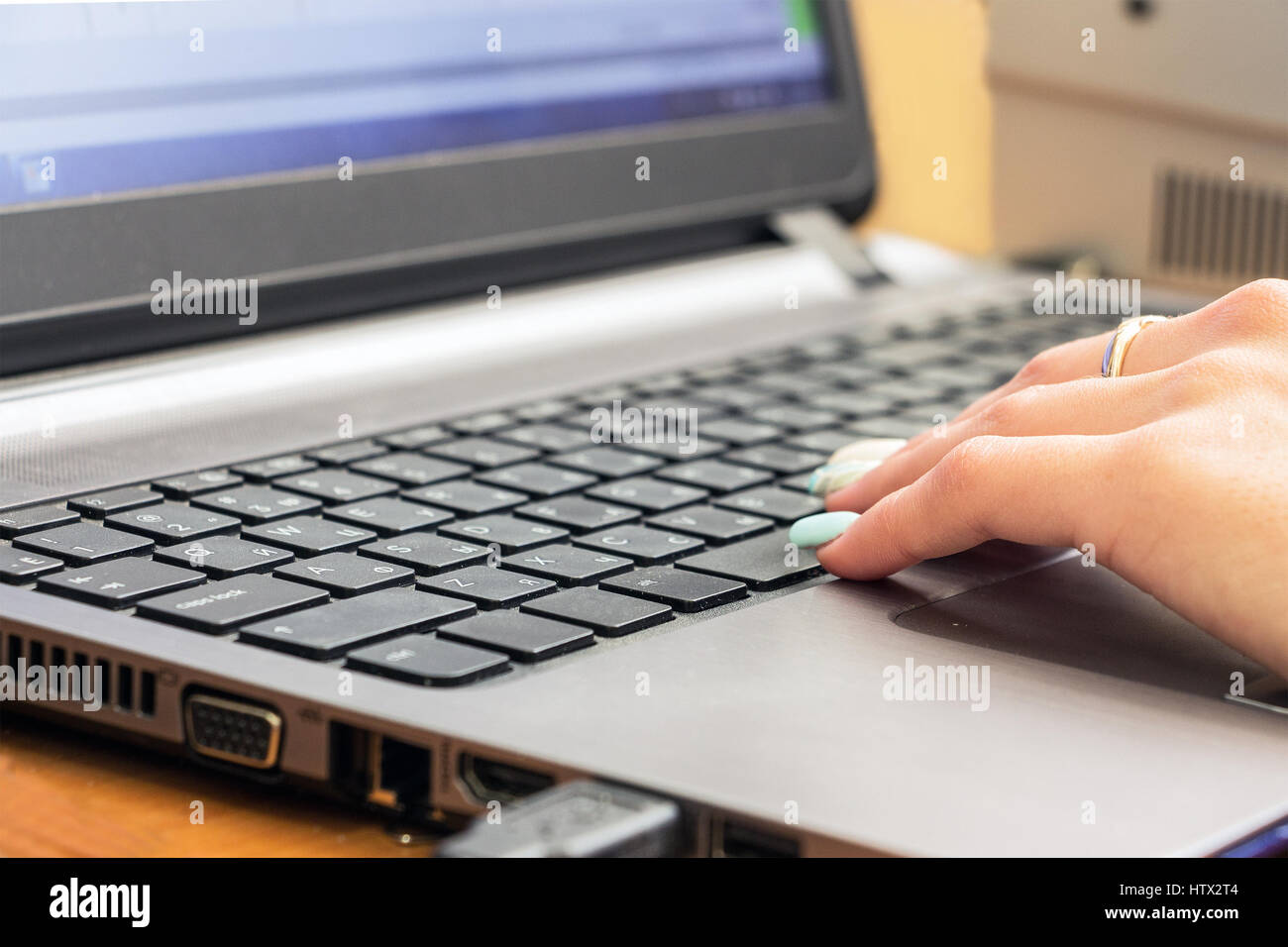 Woman's hand on keyboard Stock Photo - Alamy
