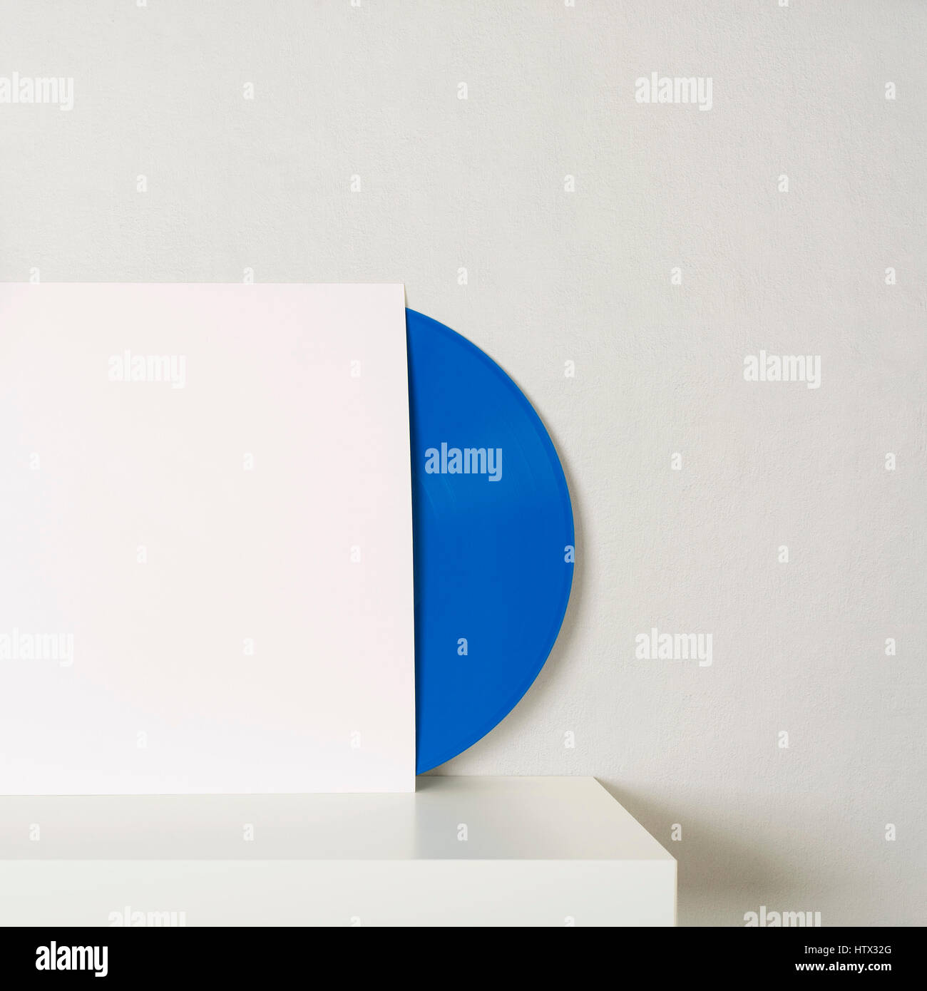 blue vinyl record in white paper case Stock Photo - Alamy