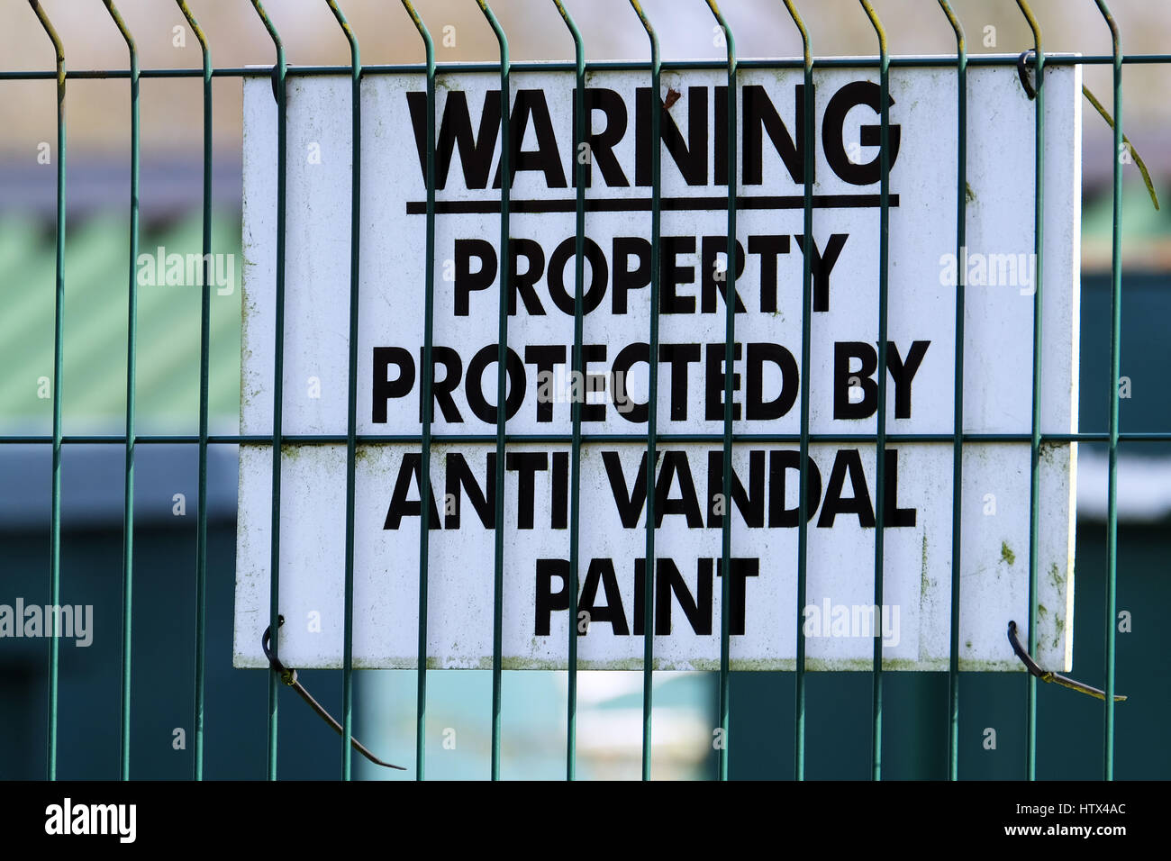 Property protected by anti vandal none drying paint warning sign Stock ...