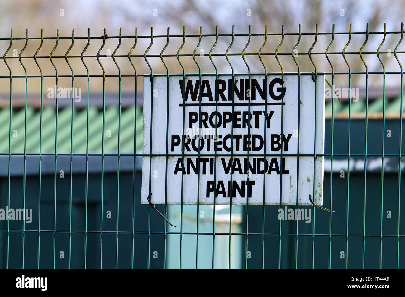 Property protected by anti vandal none drying paint warning sign Stock ...