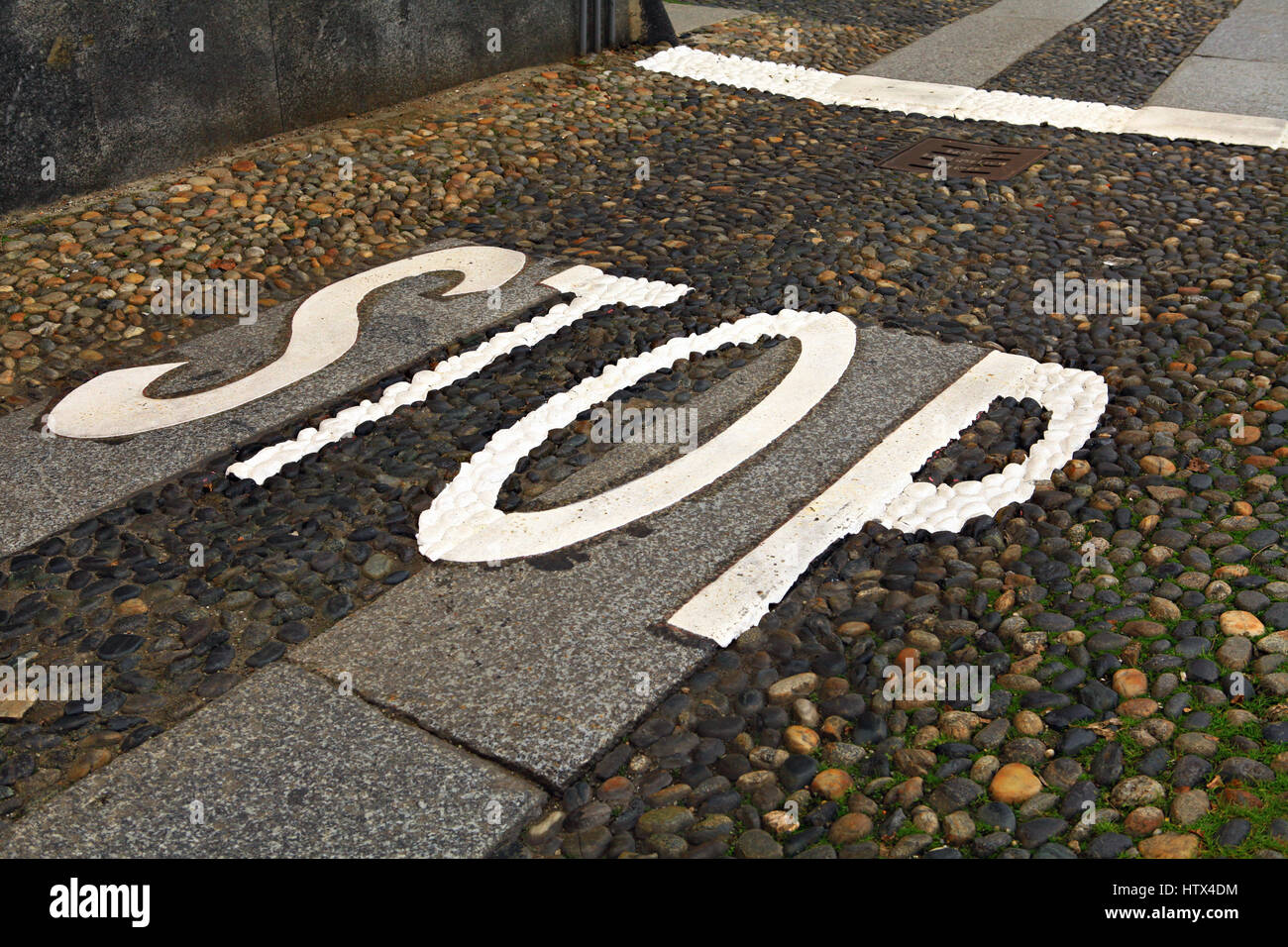 Stop sign in old Pavia street Italy Stock Photo - Alamy
