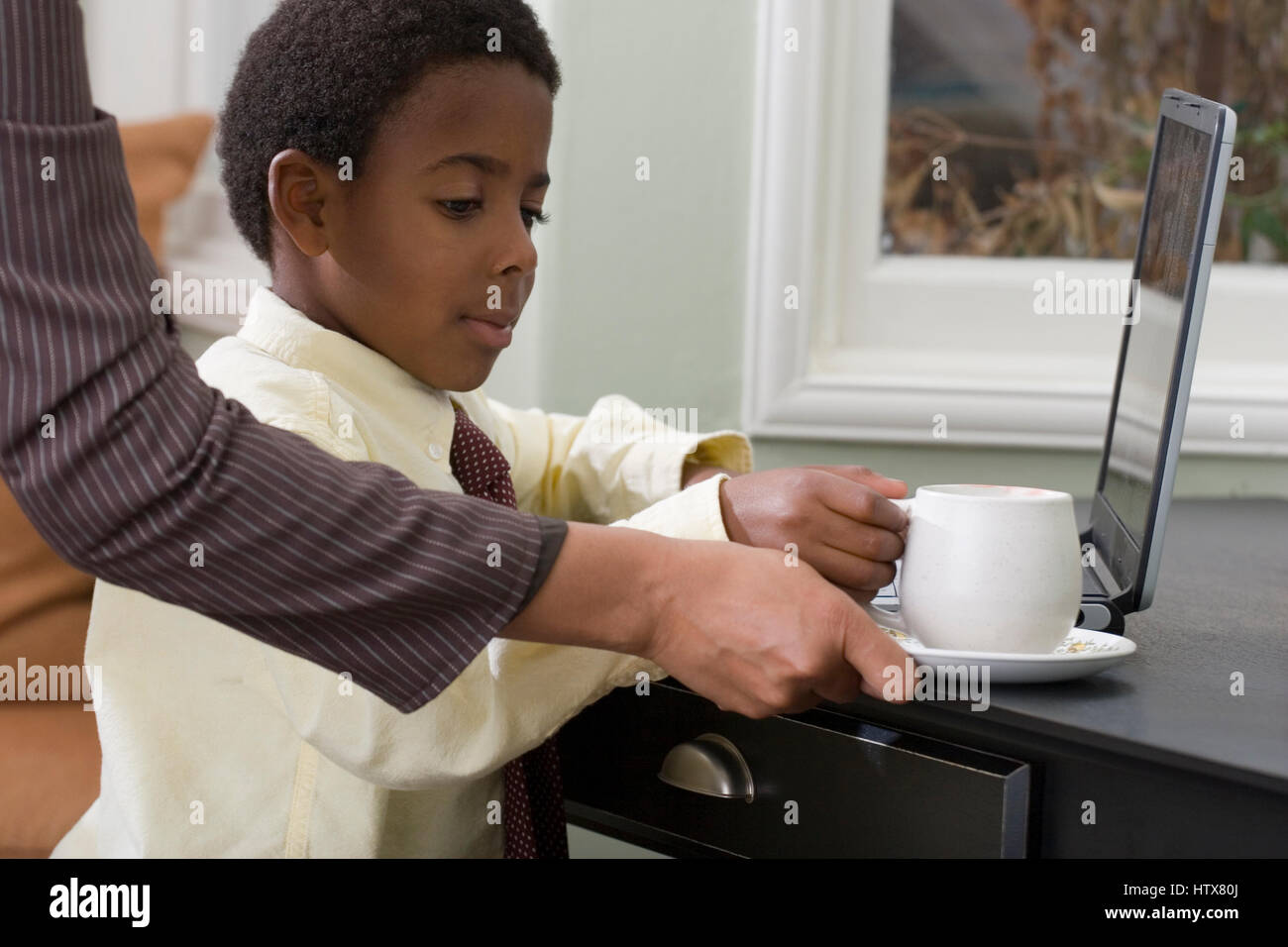 Little boy working on the computer at home Stock Photo - Alamy