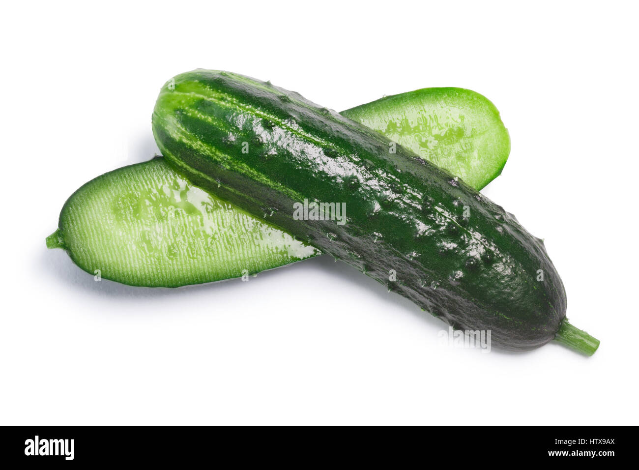 Fresh cucumber halves (Cucumis sativus), crosswise, top view. Clipping ...