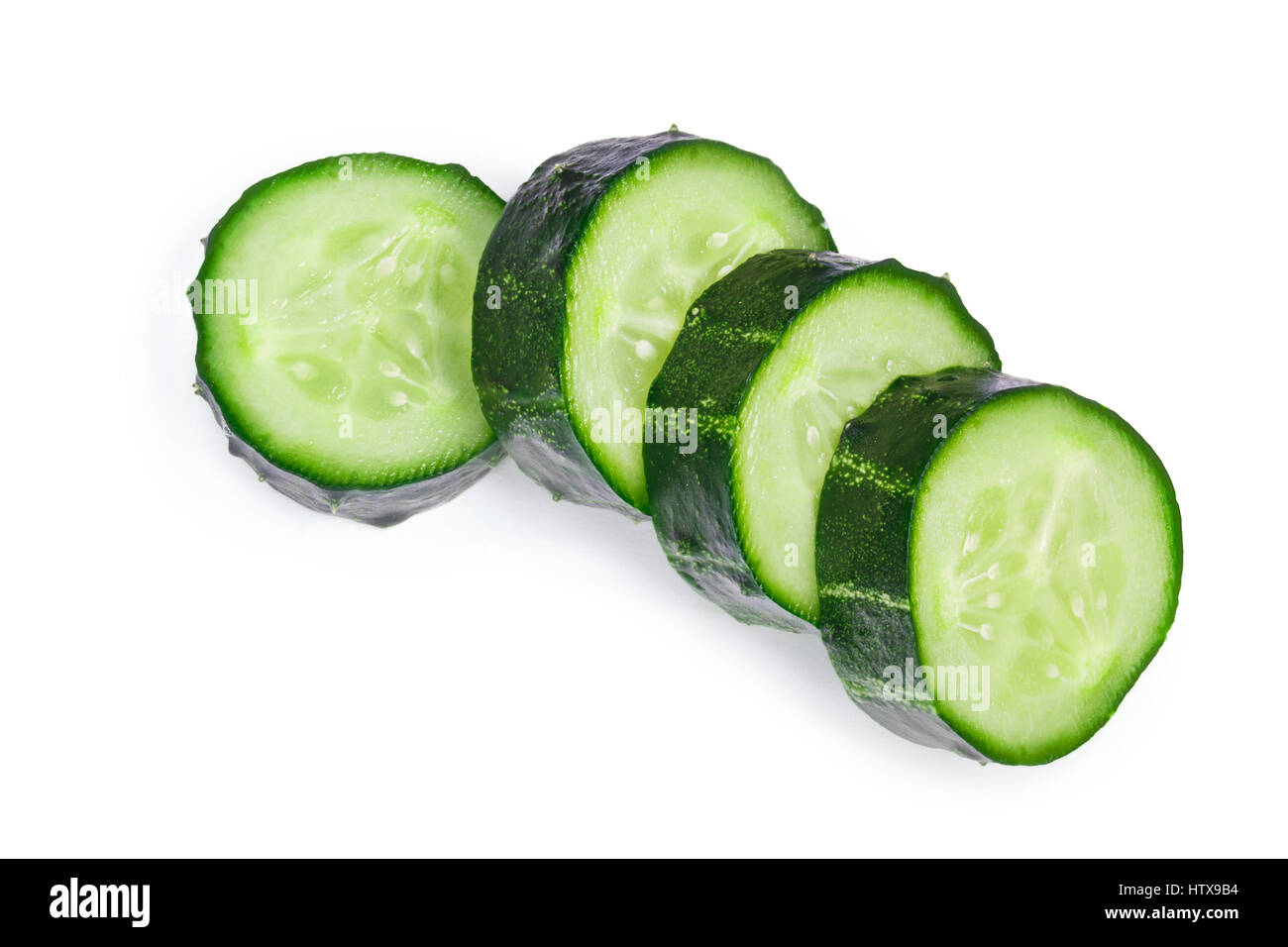 Fresh cucumber ring slices (Cucumis sativus), top view. Clipping paths ...