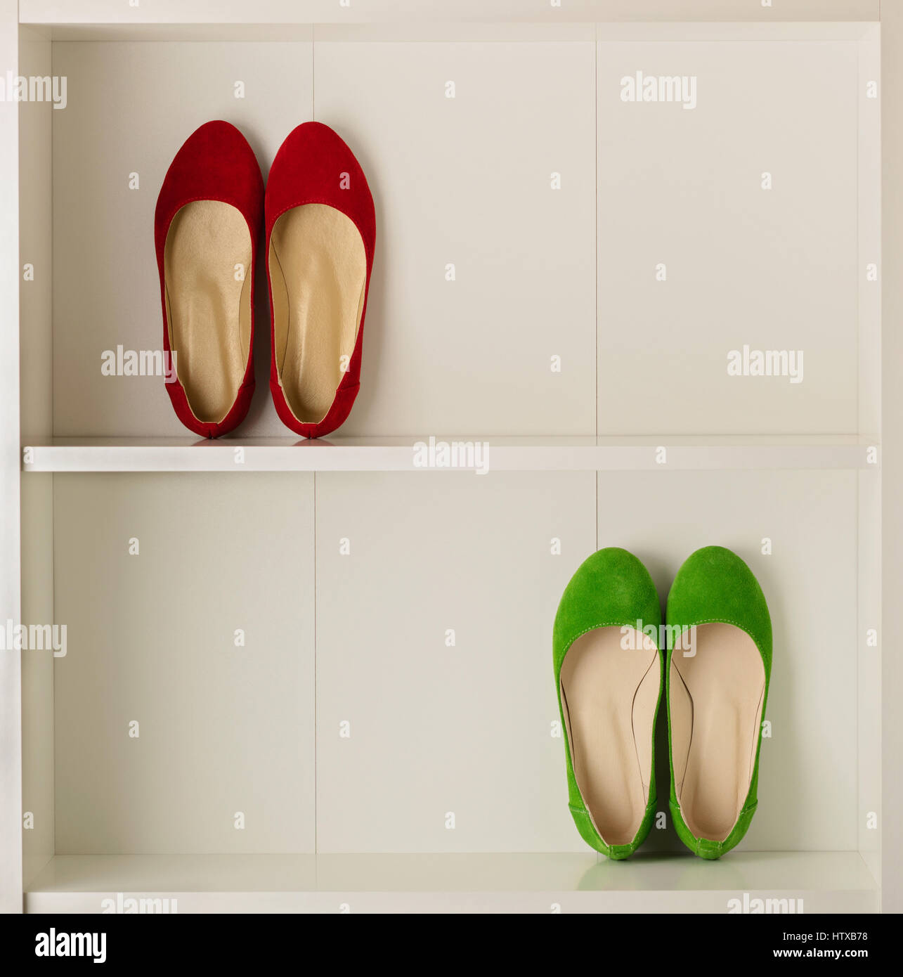 Women's shoes (ballet shoes) in the white wardrobe. Selective focus ...