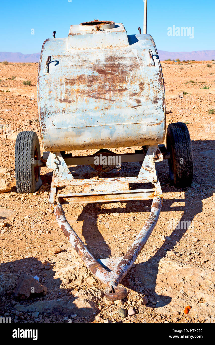 water tank in morocco africa land gray metal weel and arid Stock Photo ...