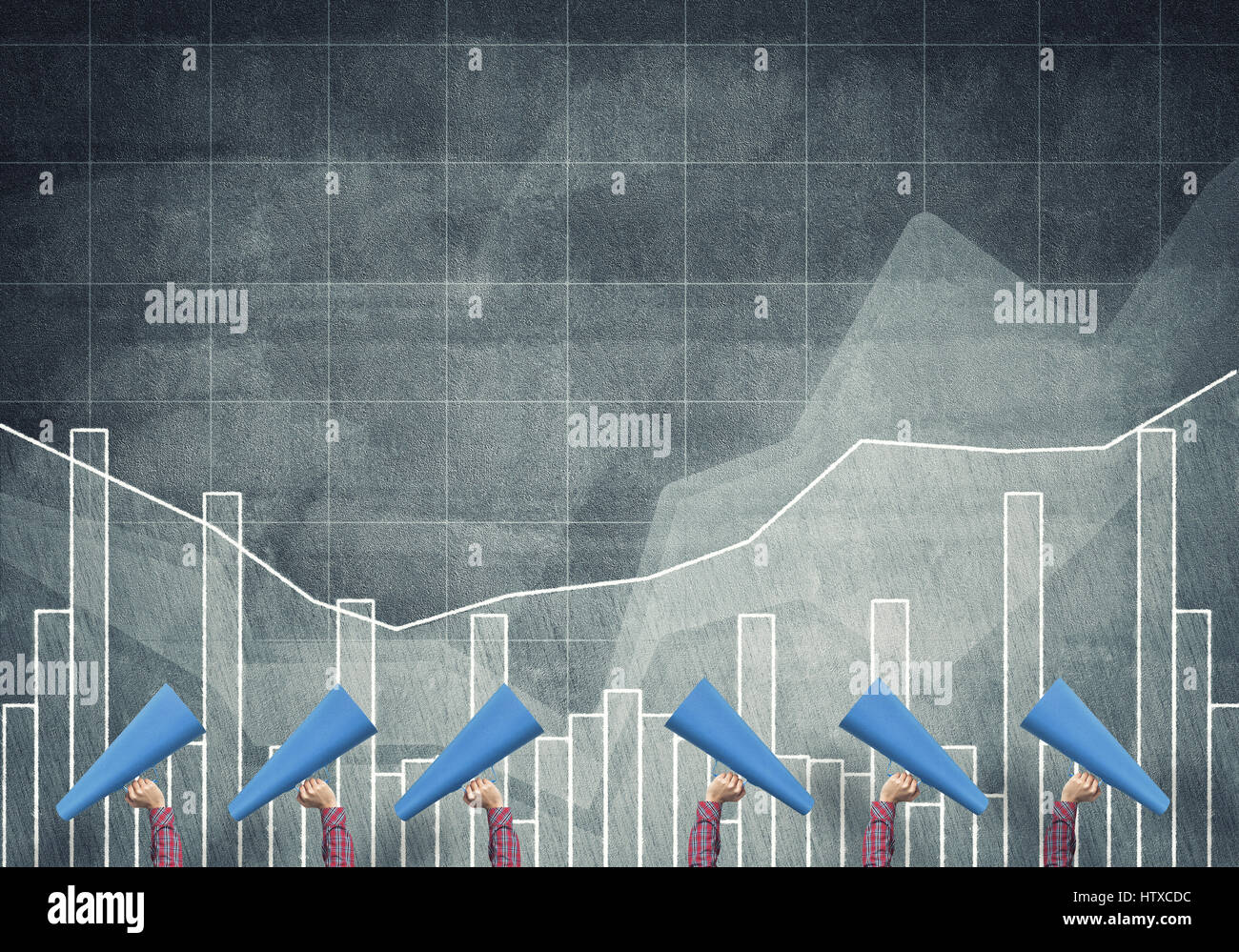 female hands in a row holding blue paper trumpets against graphs ...