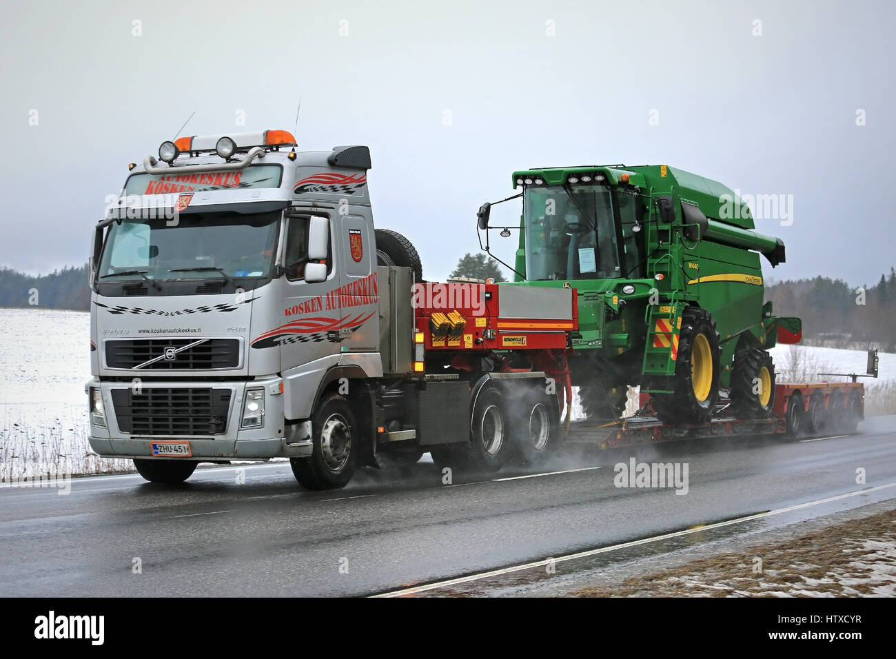 SALO, FINLAND - MARCH 10, 2017: Volvo FH16 560 semi hauls John Deere ...