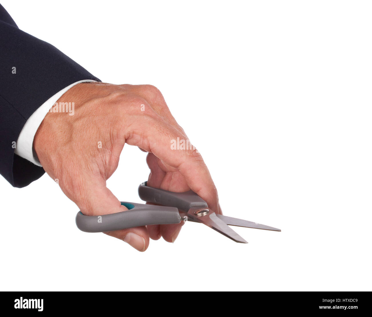 hand businessman cutting with pair of scissors. Isolated on white ...
