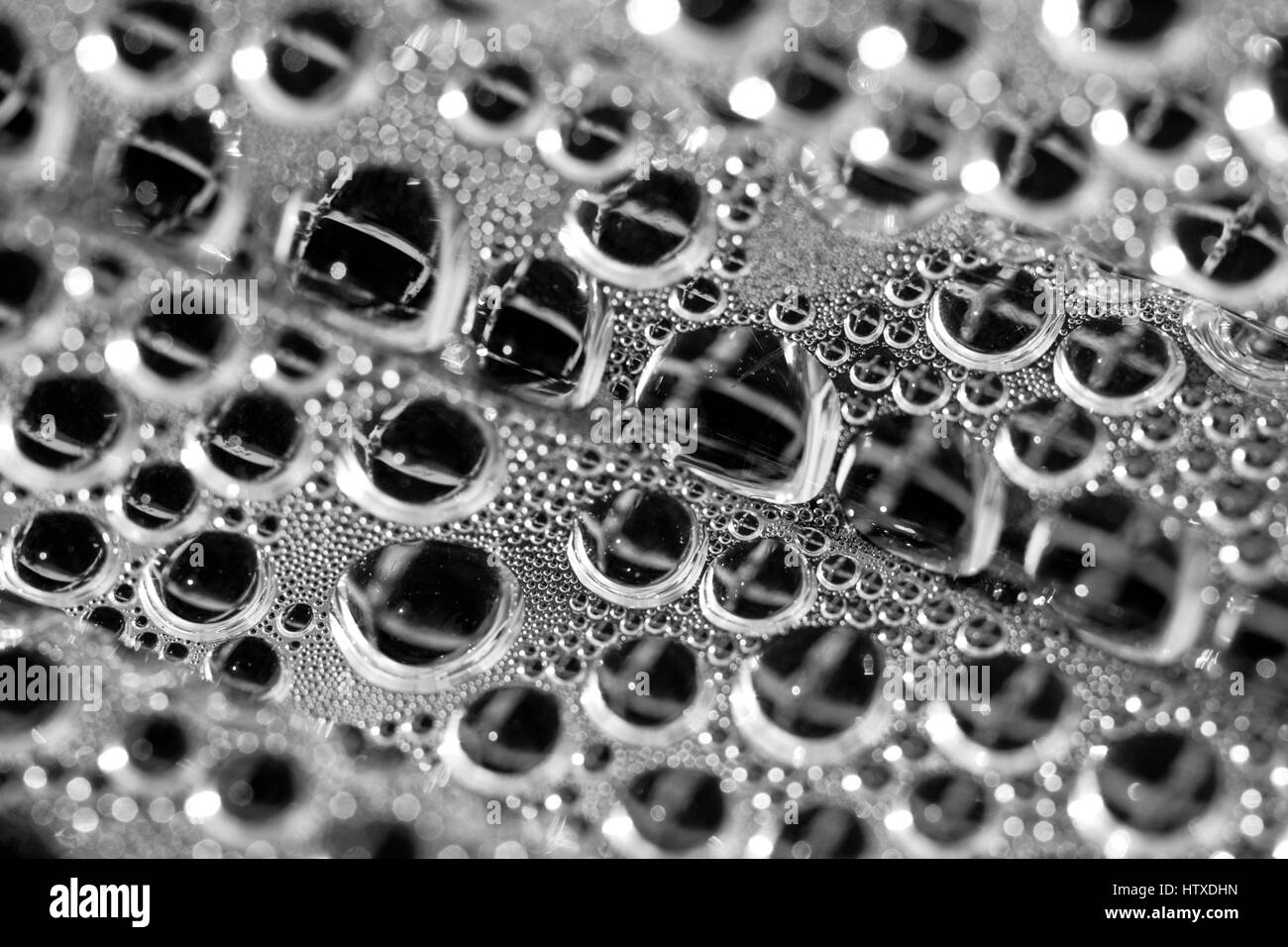 Water droplets, condensation , bubbles VERY close up. Abstract black ...