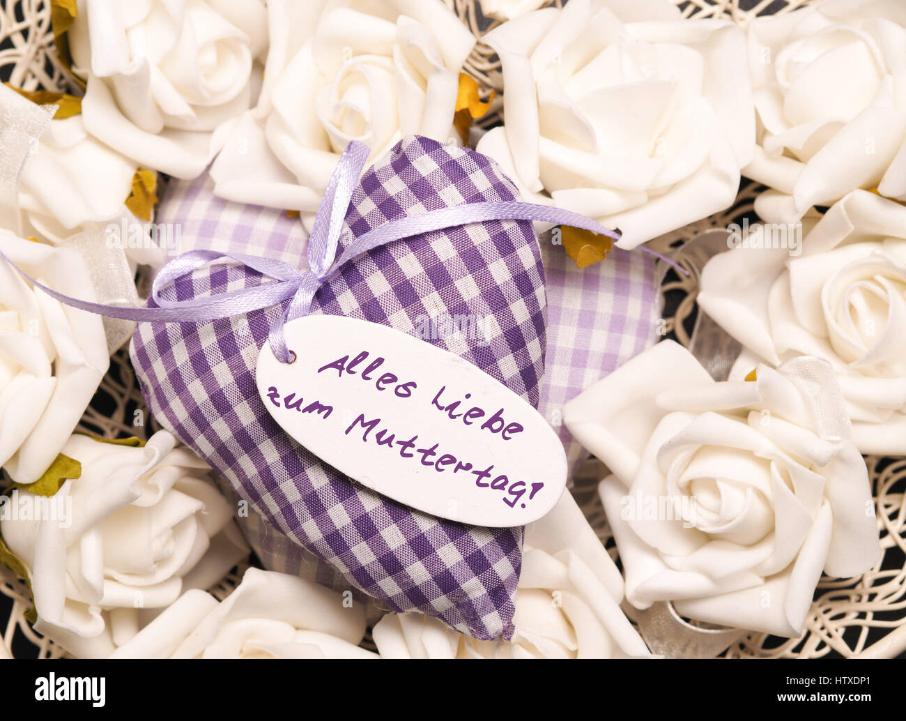 German Mothers Day background with roses and a heart shape Stock Photo ...