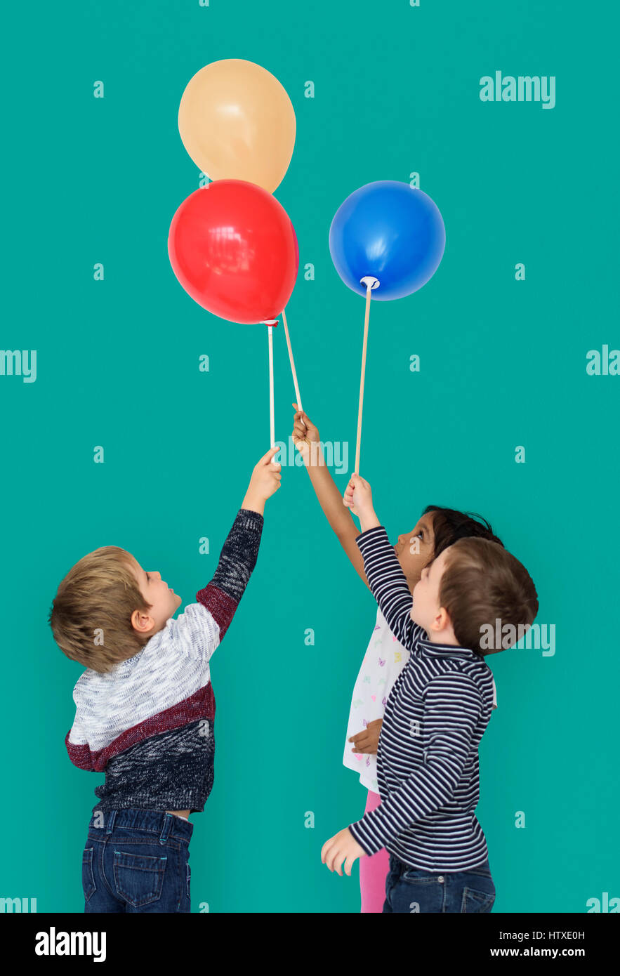 Little Kids Competing Balloons Fun Happy Stock Photo - Alamy