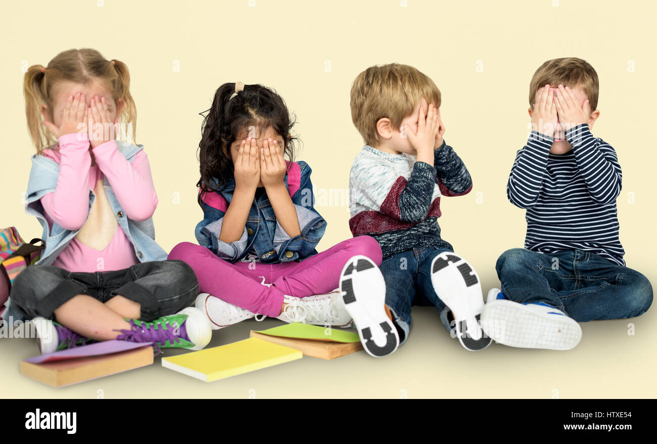Little Children Peek-A-Boo Covering Face Stock Photo - Alamy