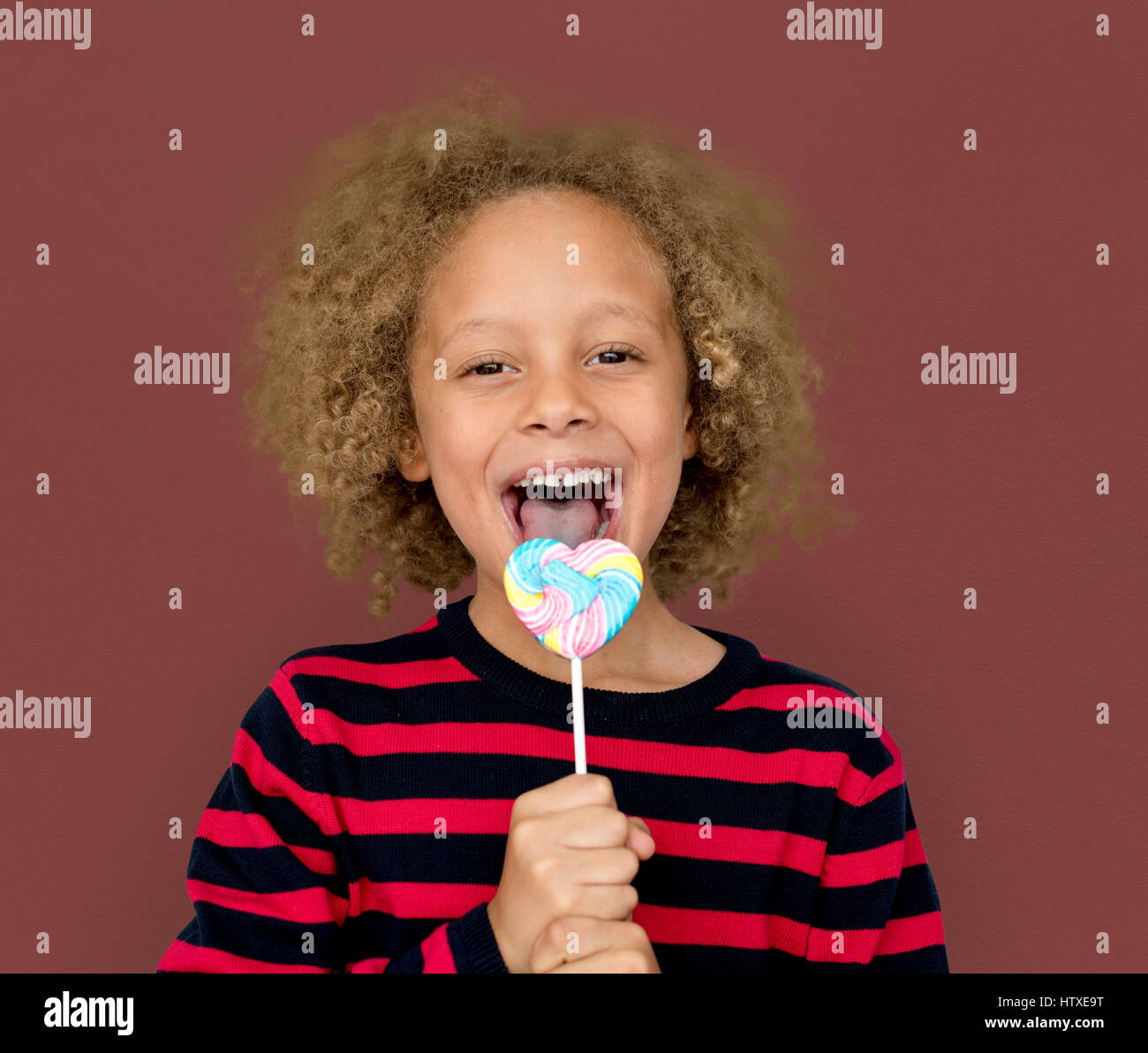 Little Boy Eating Lollipop Candy Stock Photo - Alamy