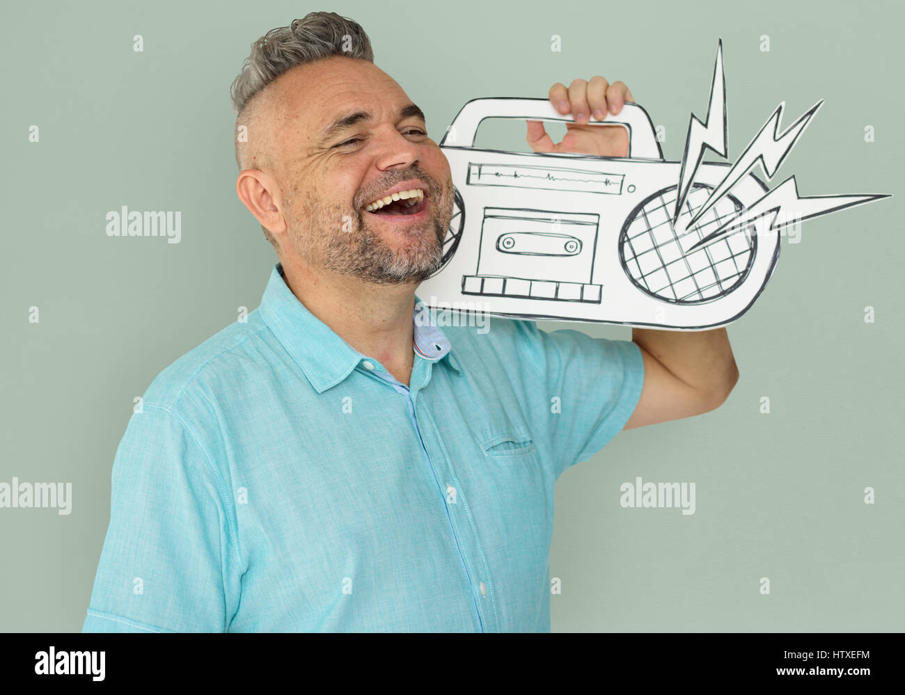 Caucasian Man Holding Paper Crafted Jukebox Stock Photo - Alamy