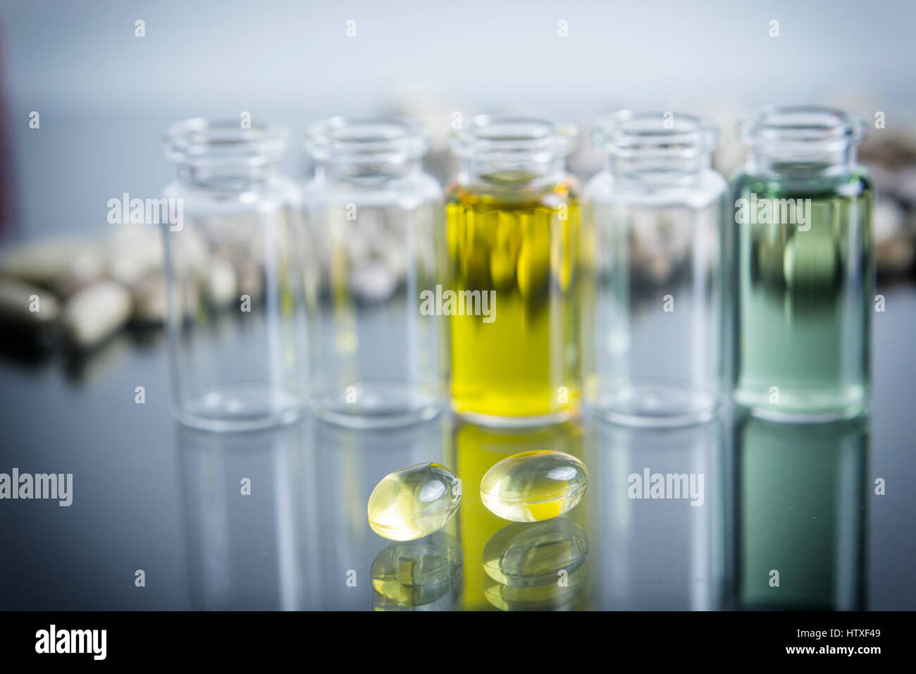 capsules of oil, instruments in laboratory Stock Photo - Alamy