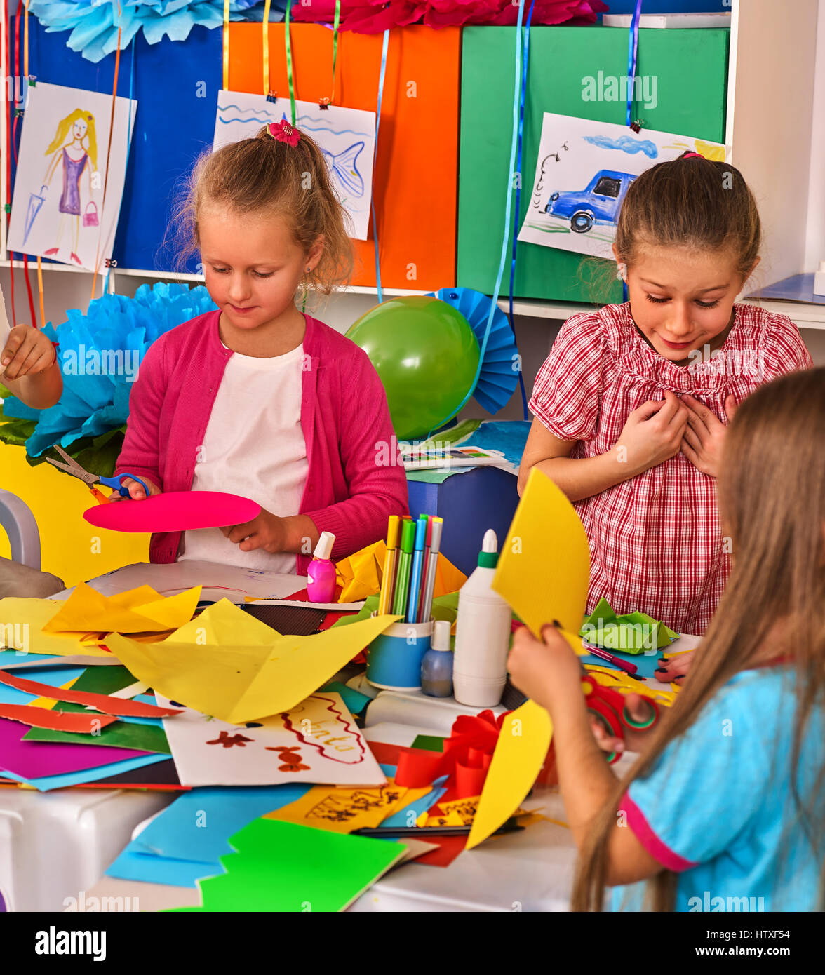 Children cutting paper in class. Development social lerning in school ...