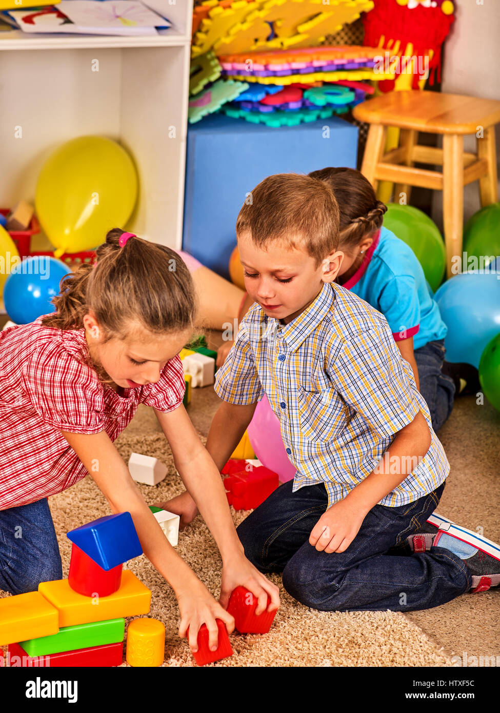 Children playing in kids club indoor. Lesson in primary school Stock ...