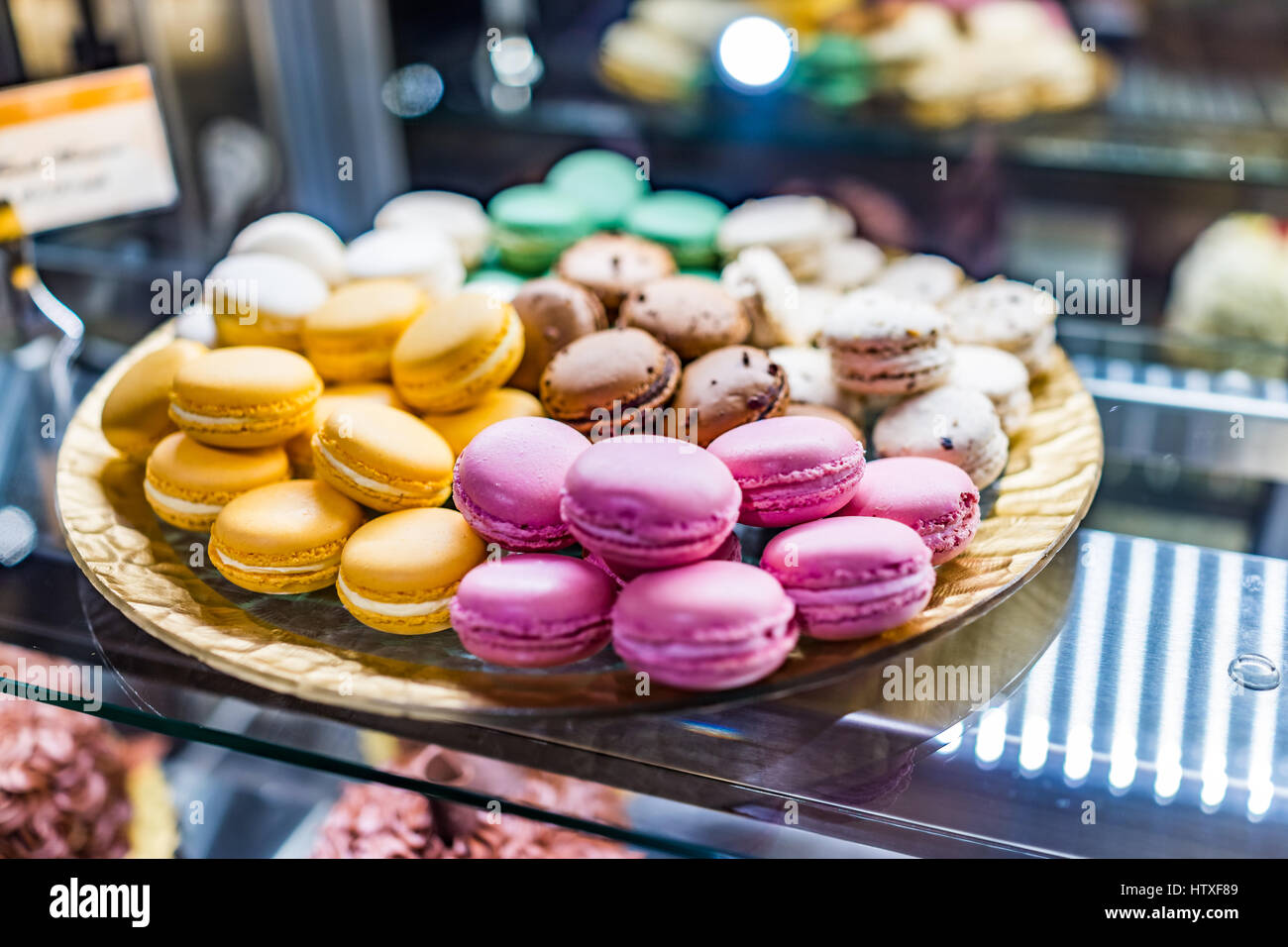 Display of pile of many colorful small macarons on tray Stock Photo - Alamy