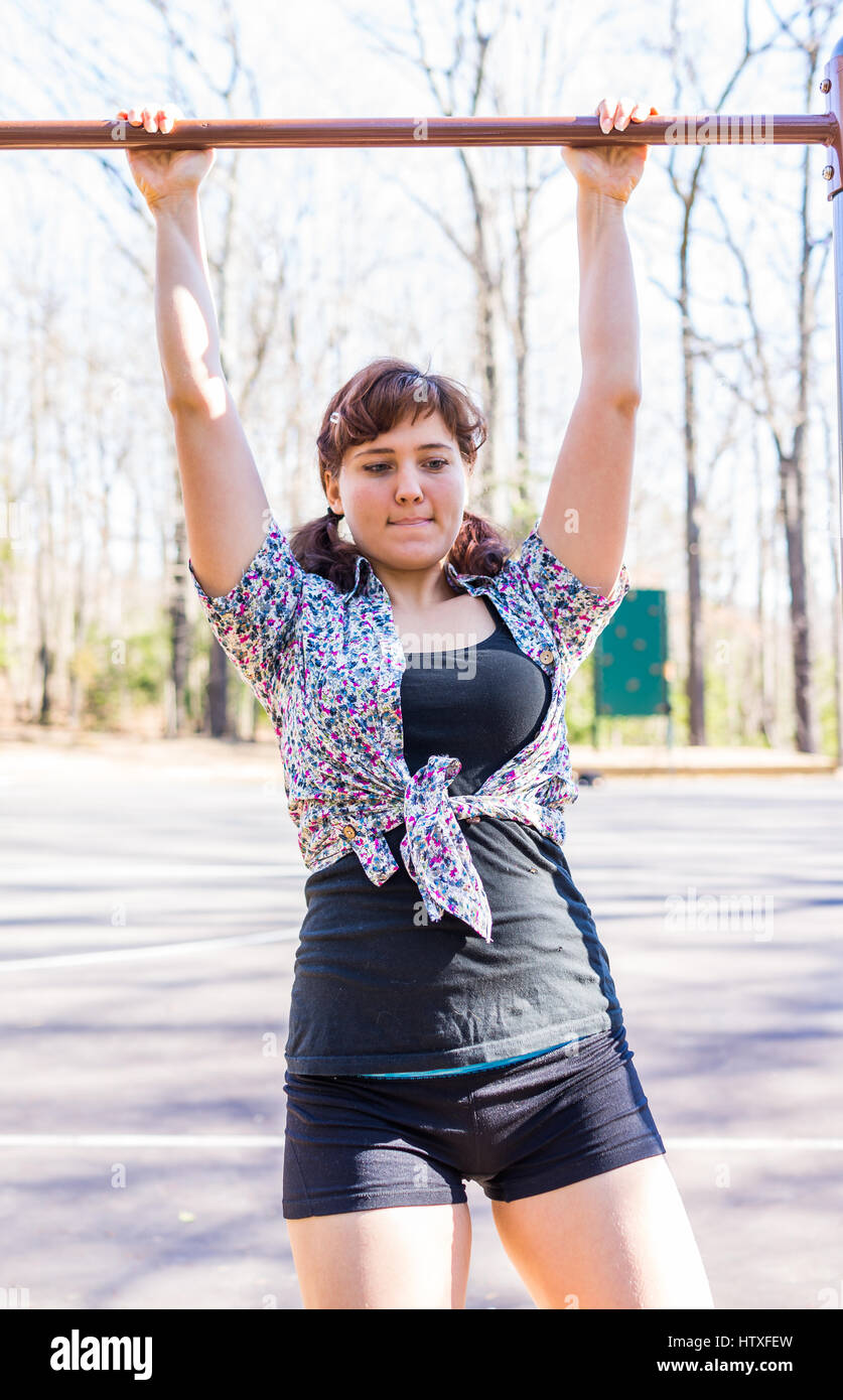 Girl doing pull ups hi-res stock photography and images - Alamy