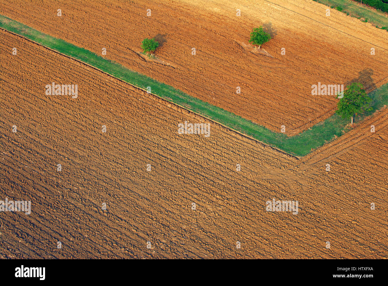 Aerial view of agriculture: cultivated fields, roads and urban traffic ...