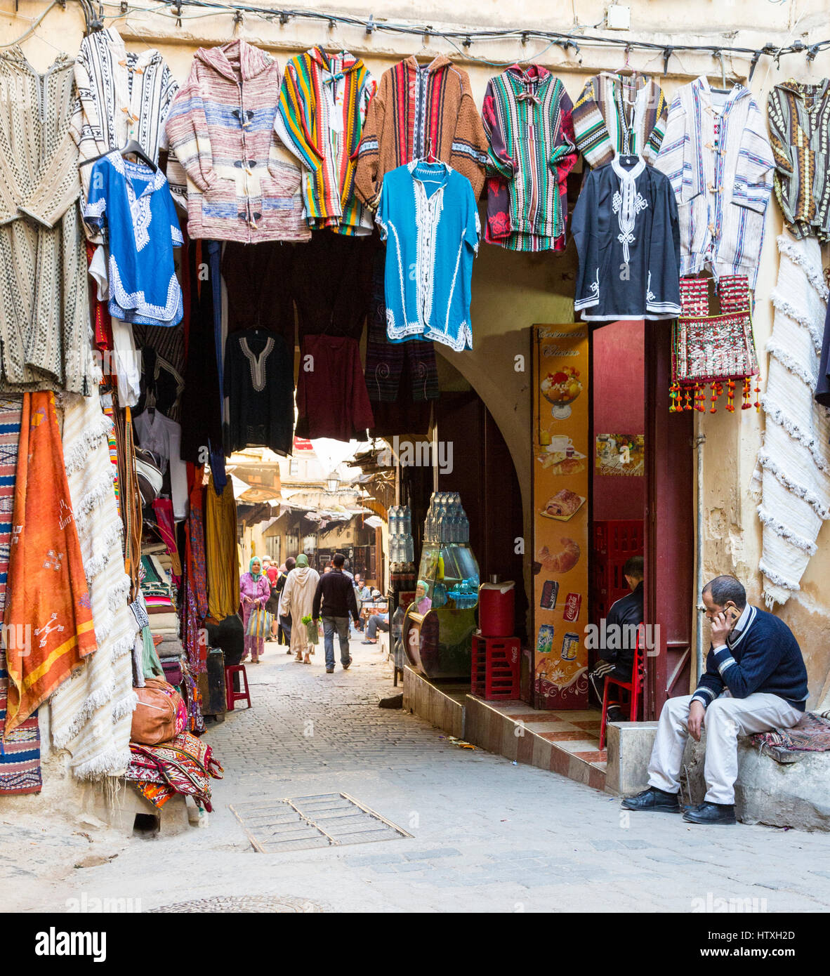 Fes, Morocco. Street Scene in the Medina. Clothes for Sale Stock Photo ...