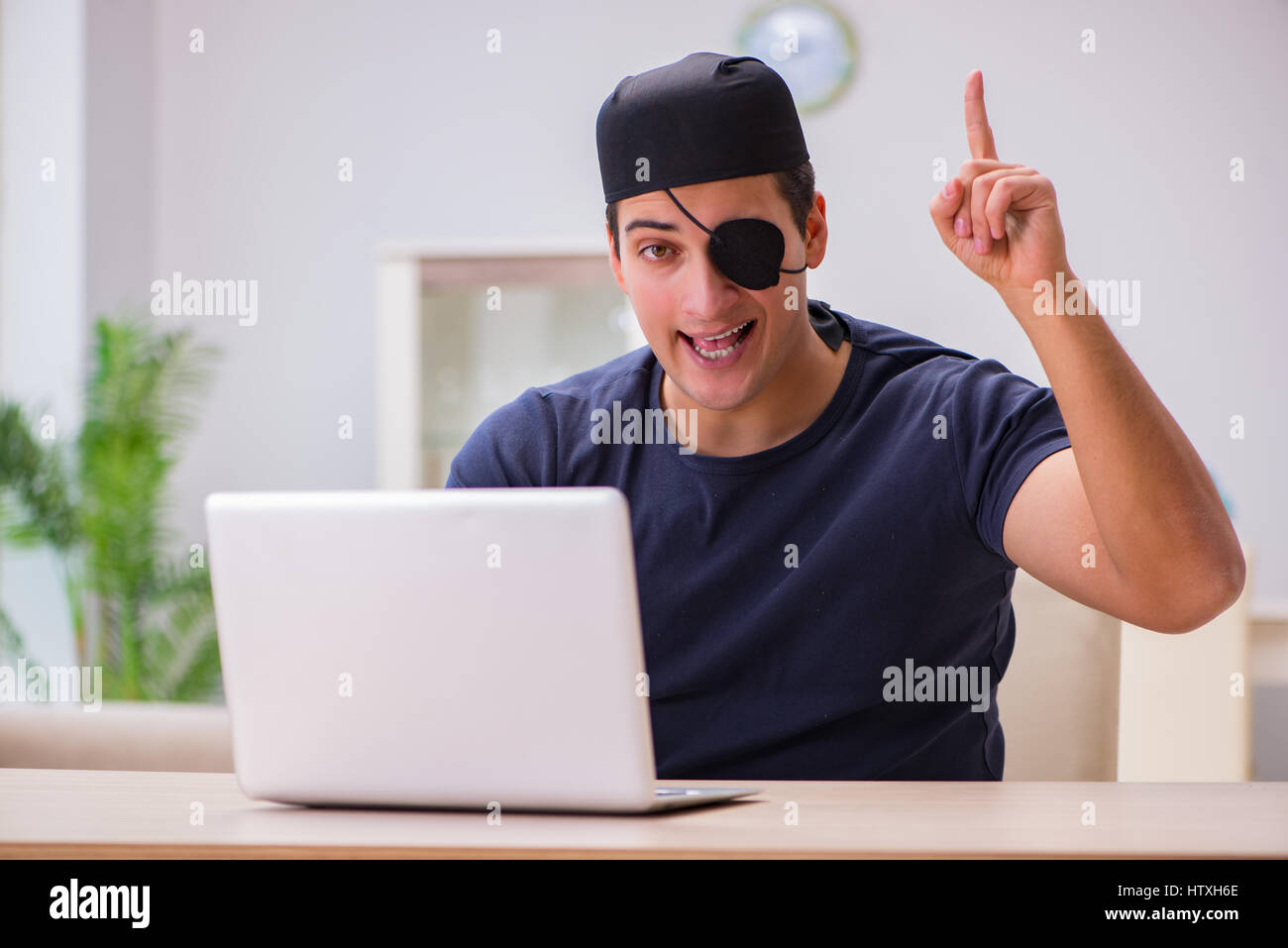 Digital security concept with pirate at computer Stock Photo - Alamy