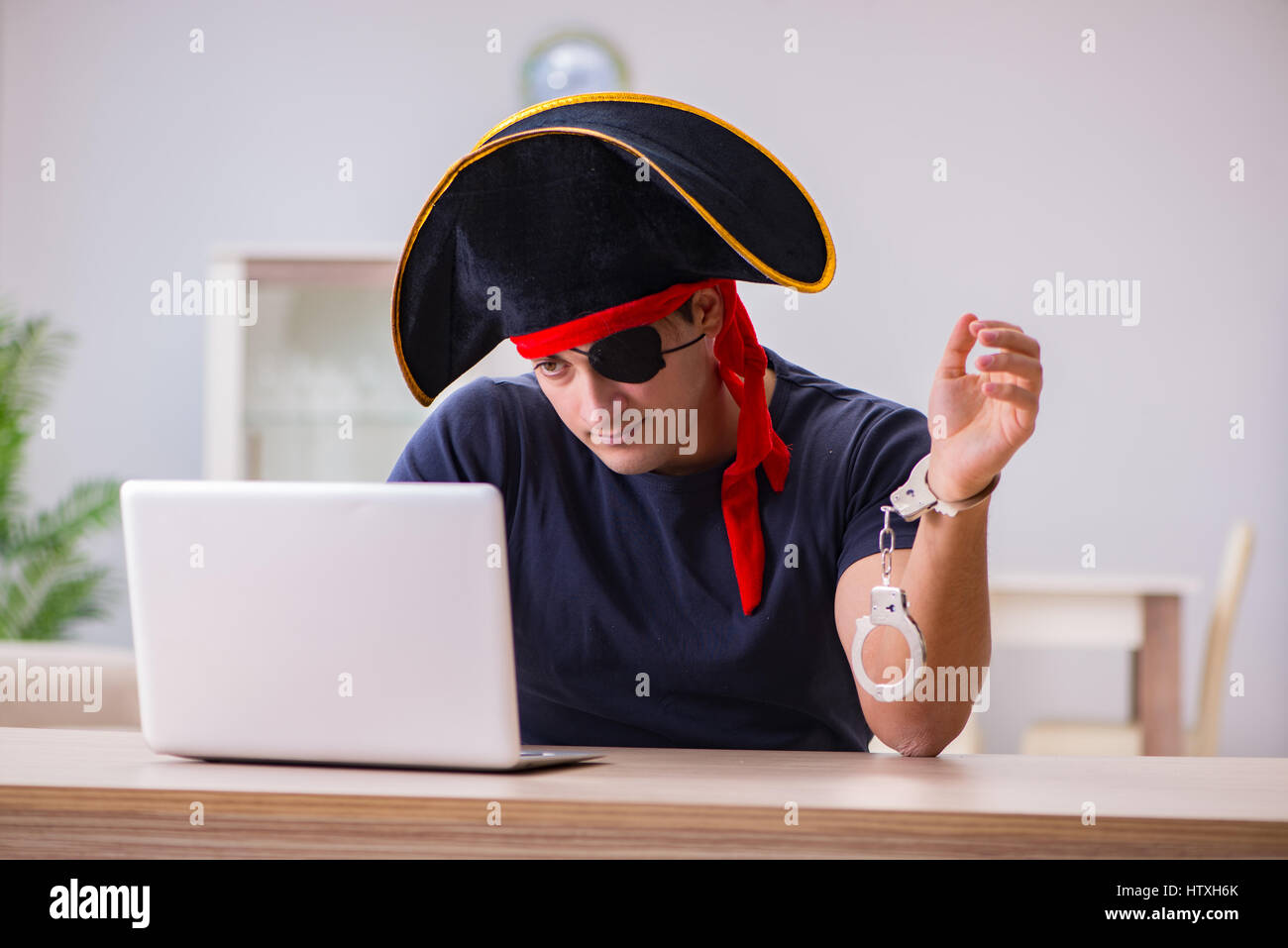Digital security concept with pirate at computer Stock Photo - Alamy