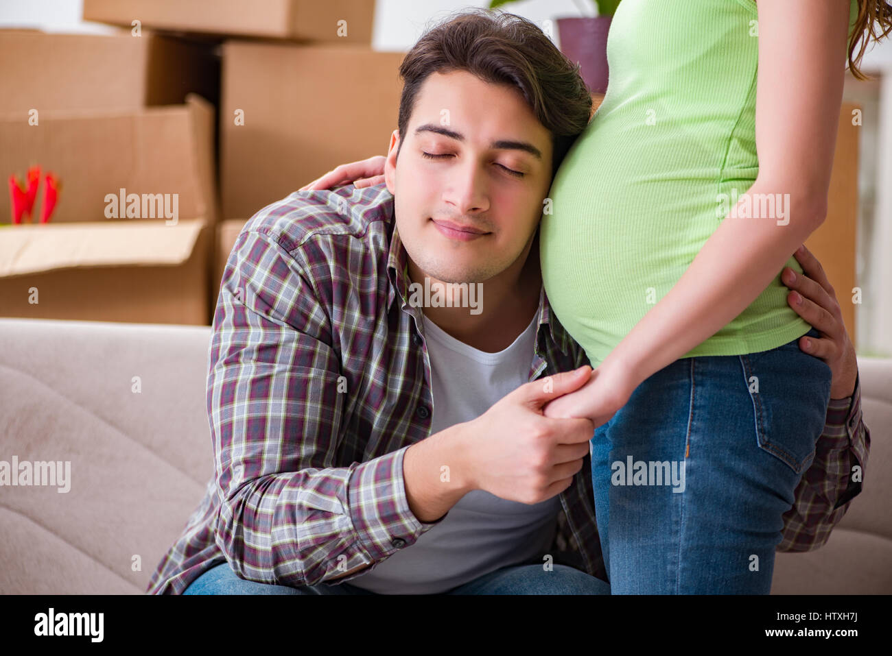 Young couple of man and pregnant wife expecting baby Stock Photo - Alamy