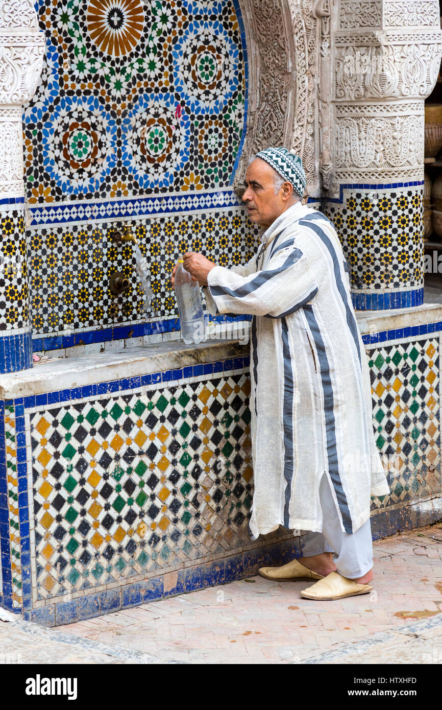 Fes, Morocco. Place Nejjarine. Man Filling His Water Bottle at the ...