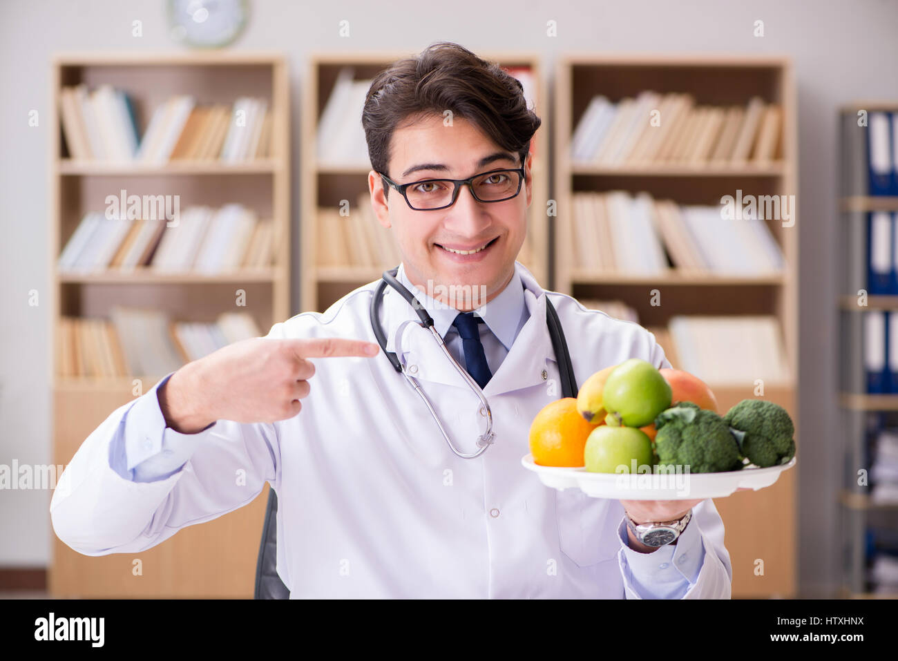 Doctor in dieting concept with fruits and vegetables Stock Photo - Alamy