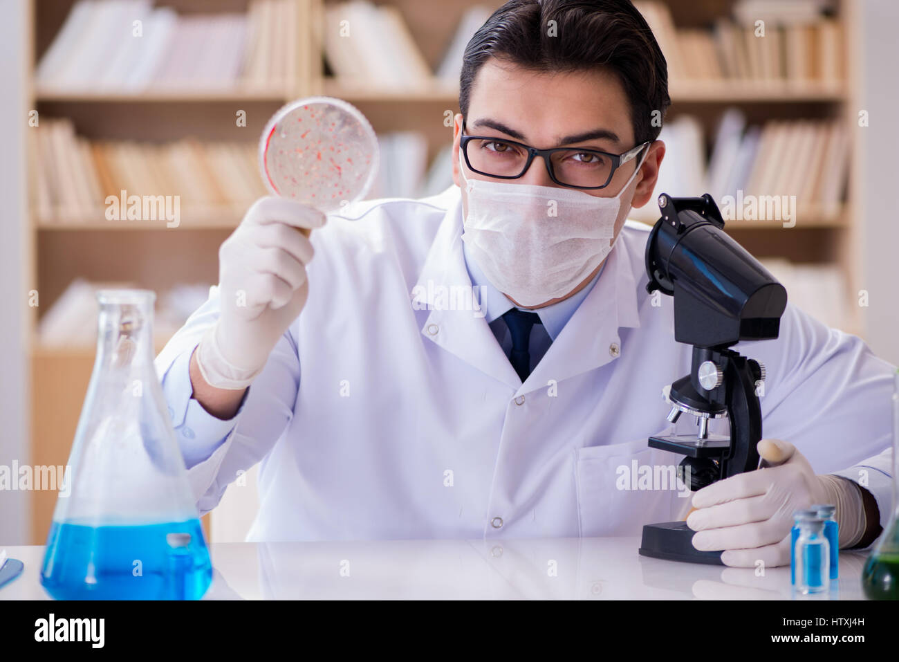Doctor studying virus bacteria in the lab Stock Photo - Alamy