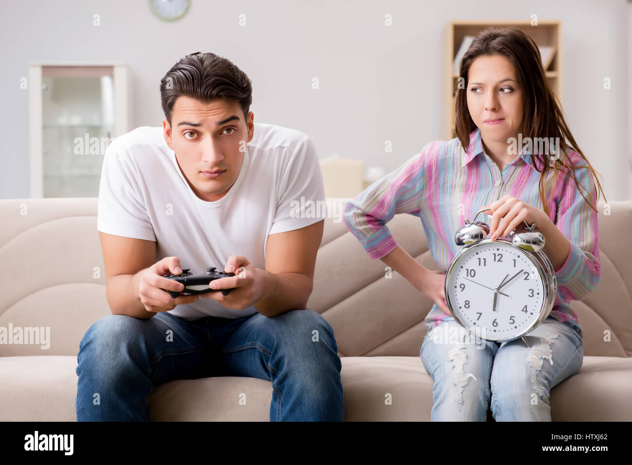 Young family suffering from computer games addiction Stock Photo - Alamy