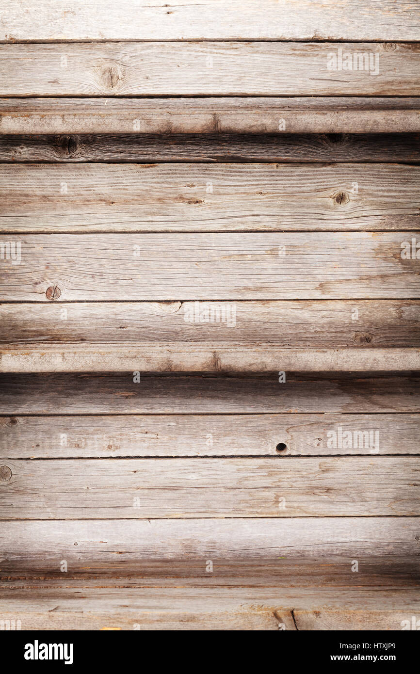 Empty wooden shelves in front of wooden wall with copy space Stock ...