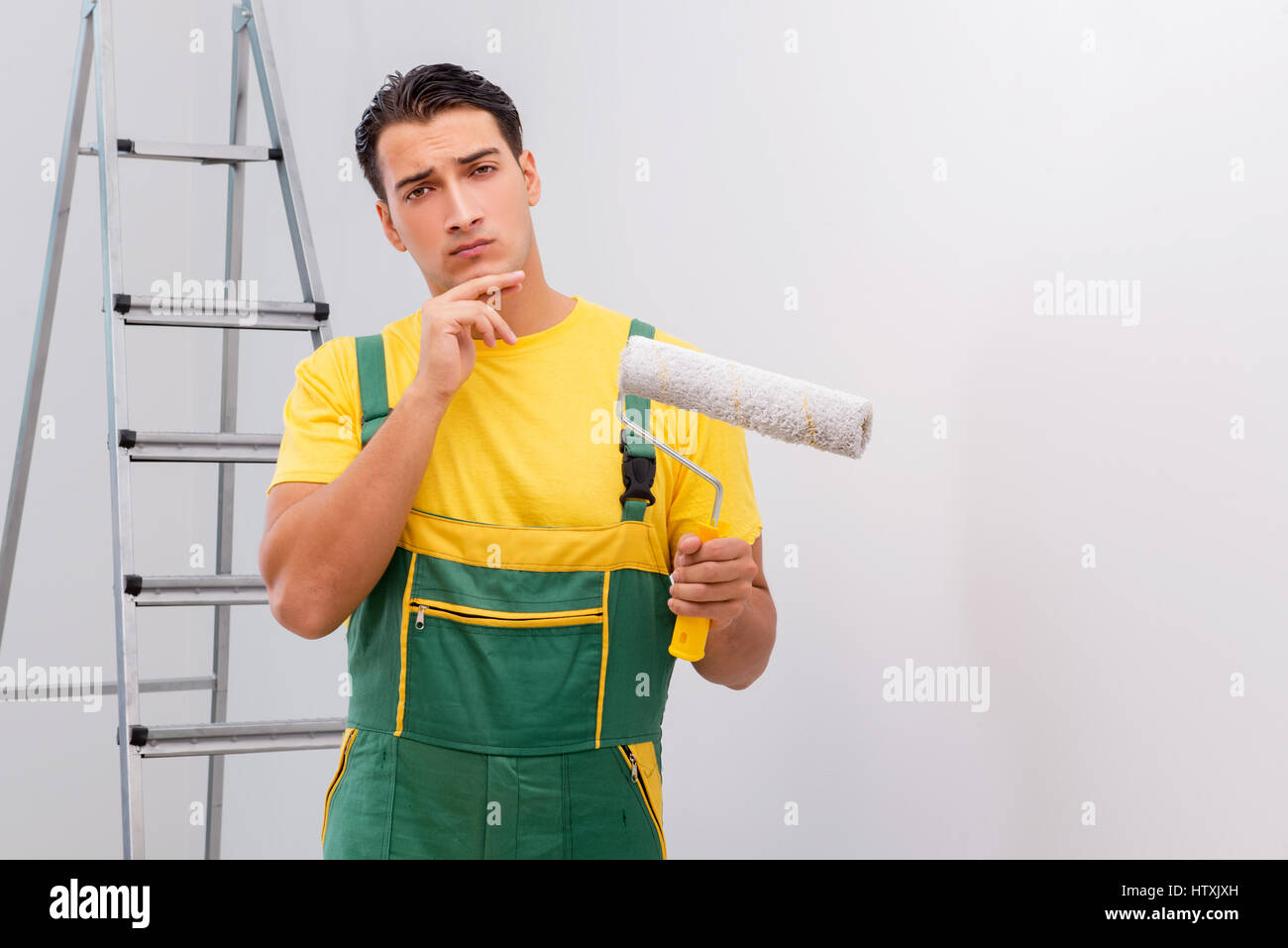 Man painting the wall in DIY concept Stock Photo - Alamy