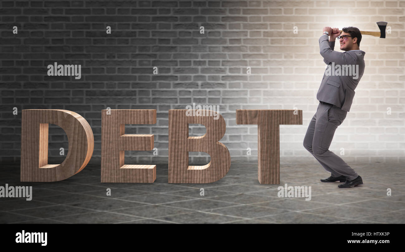 Angry man with axe axing the word debt Stock Photo - Alamy