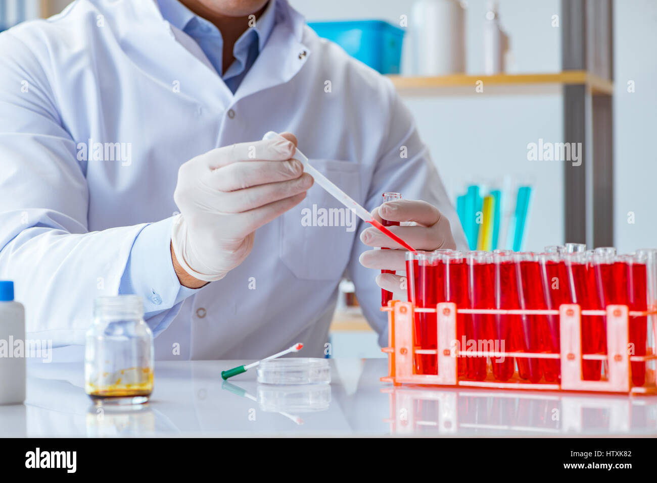 Young doctor working on blood test in lab hospital Stock Photo - Alamy