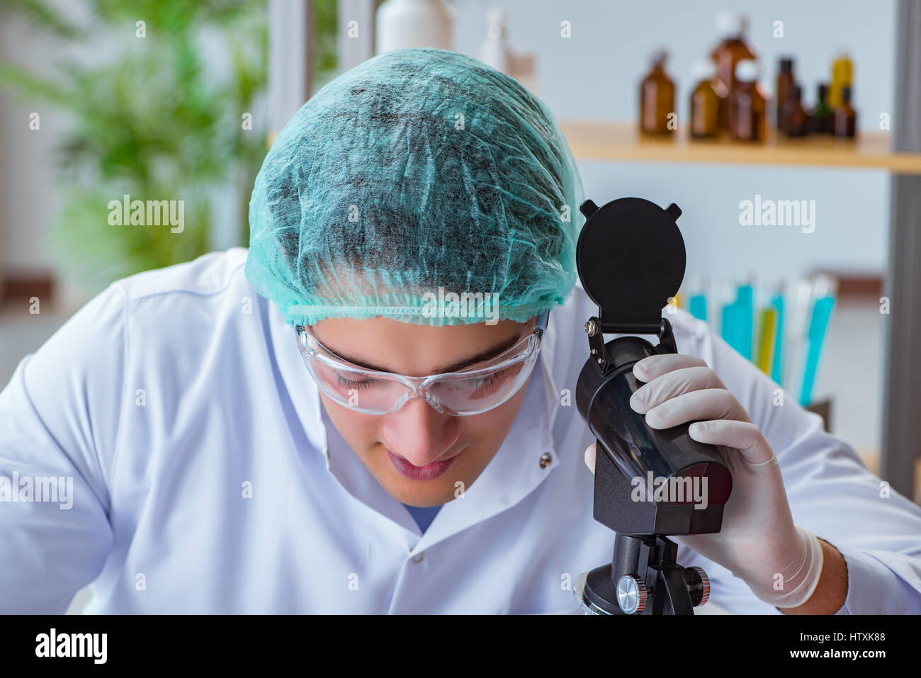 Young doctor working on blood test in lab hospital Stock Photo - Alamy